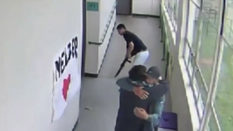 Video: Football coach disarms student with a gun at high school, hugs ...
