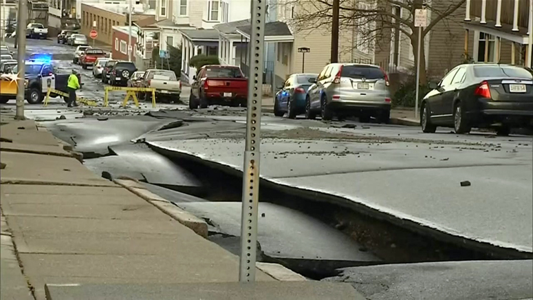 ‘A huge crater’: Massive water main break floods Fall River streets ...