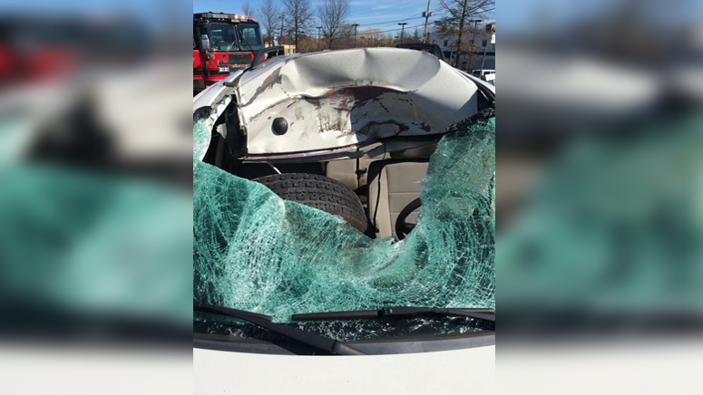 Driver injured when tire falls off trailer, smashes through windshield ...