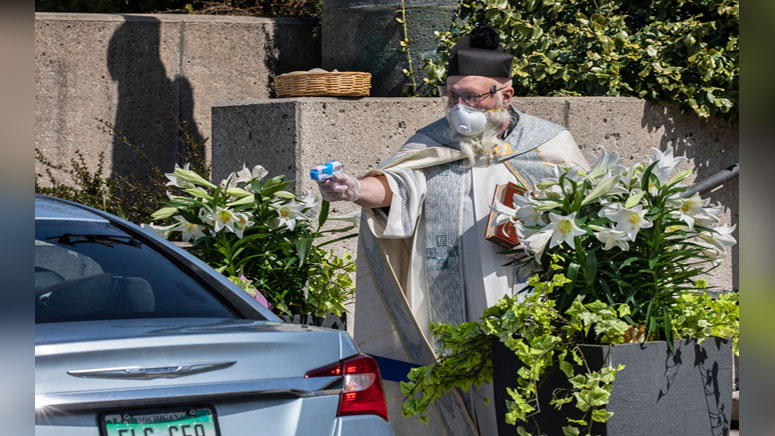 A priest fired holy water through a squirt gun at his congregants ...