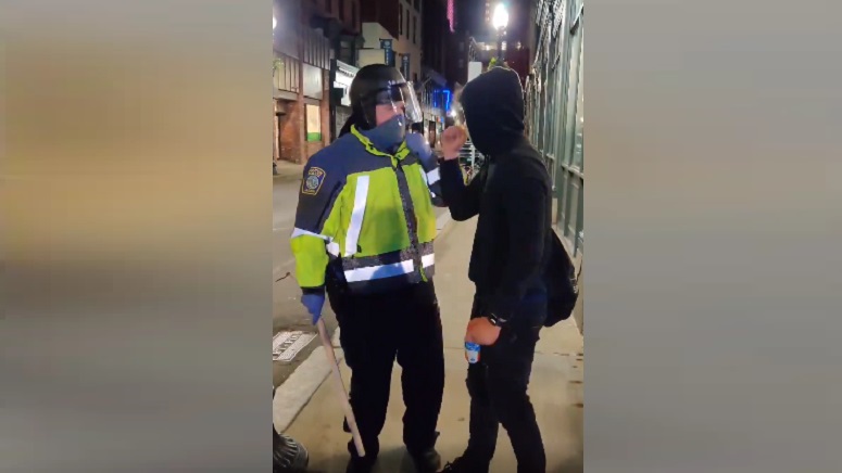 Police officer, protester exchange fist bumps in Boston during clash ...