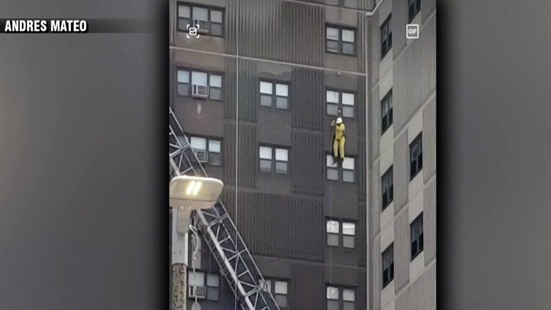 2 workers rescued after scaffolding malfunction leaves them dangling ...