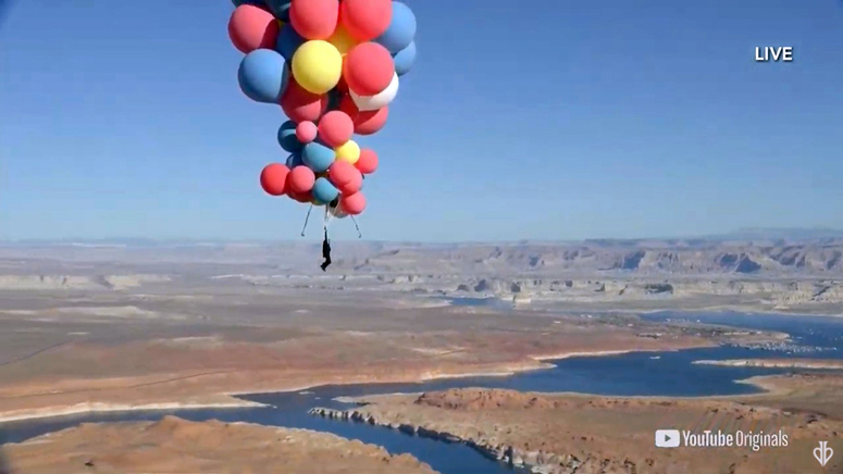 David Blaine successfully flies over the Arizona desert holding onto ...