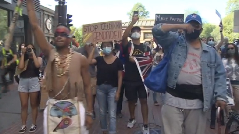 Protesters march to change Columbus Day to Indigenous Peoples Day ...
