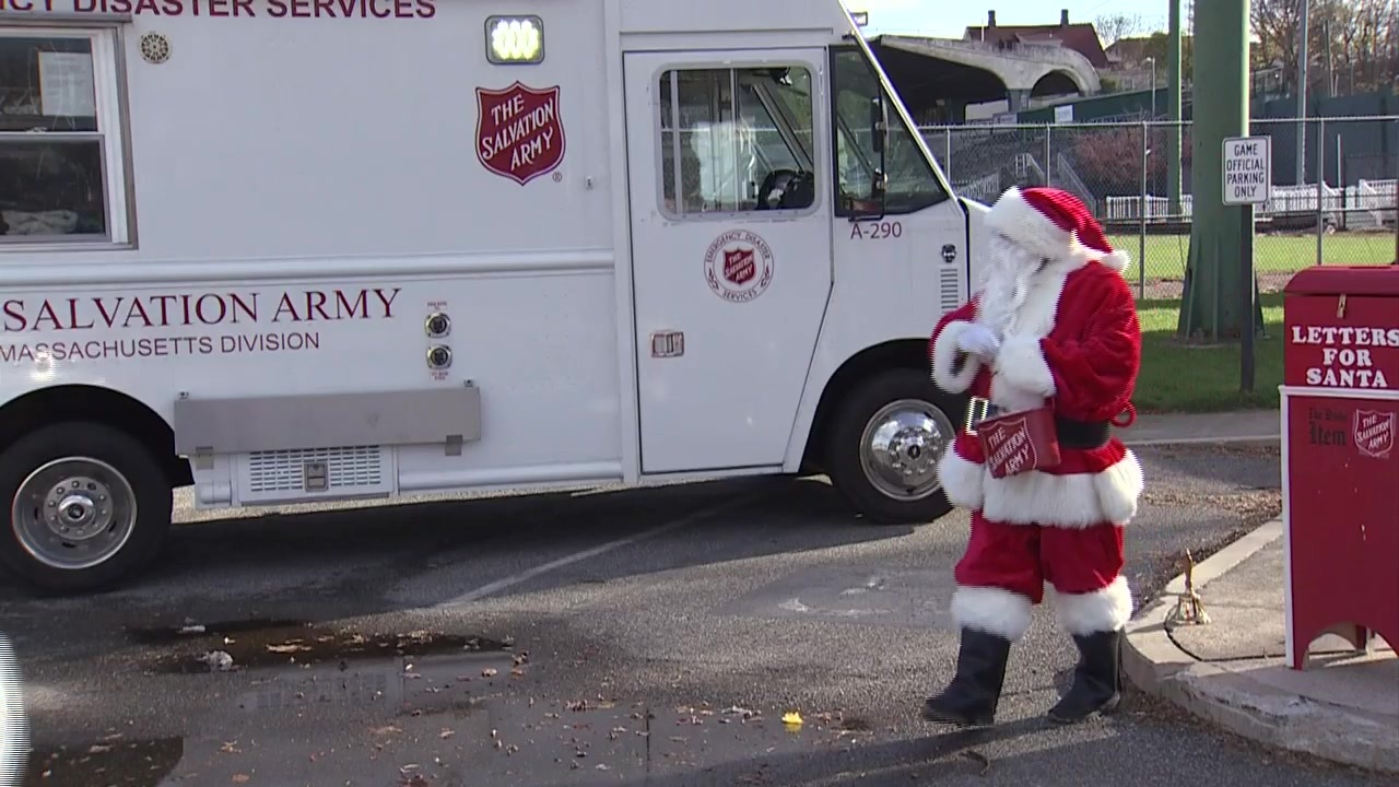 Santa Claus greets families at Salvation Army food pantry in Lynn ...