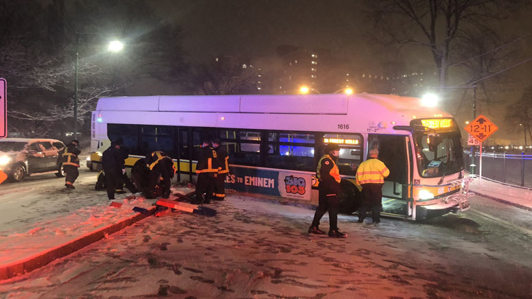 Firefighters work through cold conditions to remove MBTA bus after it ...