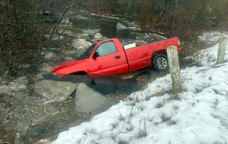 Pickup Truck Driver Veers Off Road Crashes Into Icy Mass River