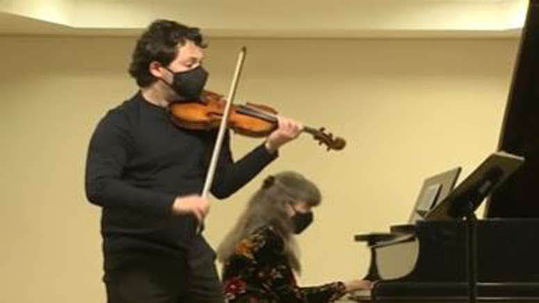Much-needed music: World-renowned violinist performs for vaccinated ...