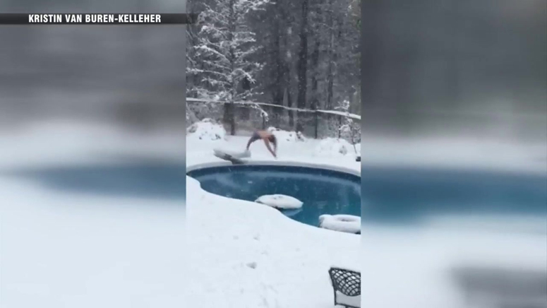 ‘Pretty refreshing’: College student dives into snow-covered pool in ...