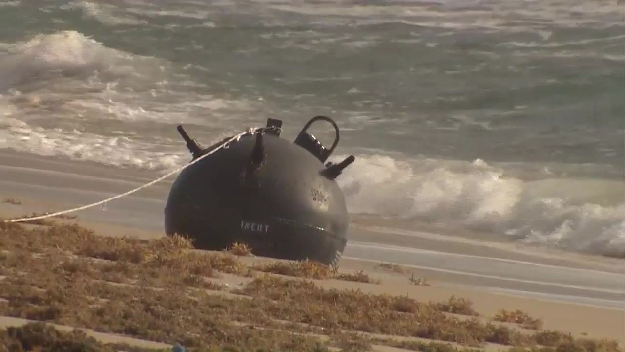 Possible military explosive device washes ashore on Florida beach ...