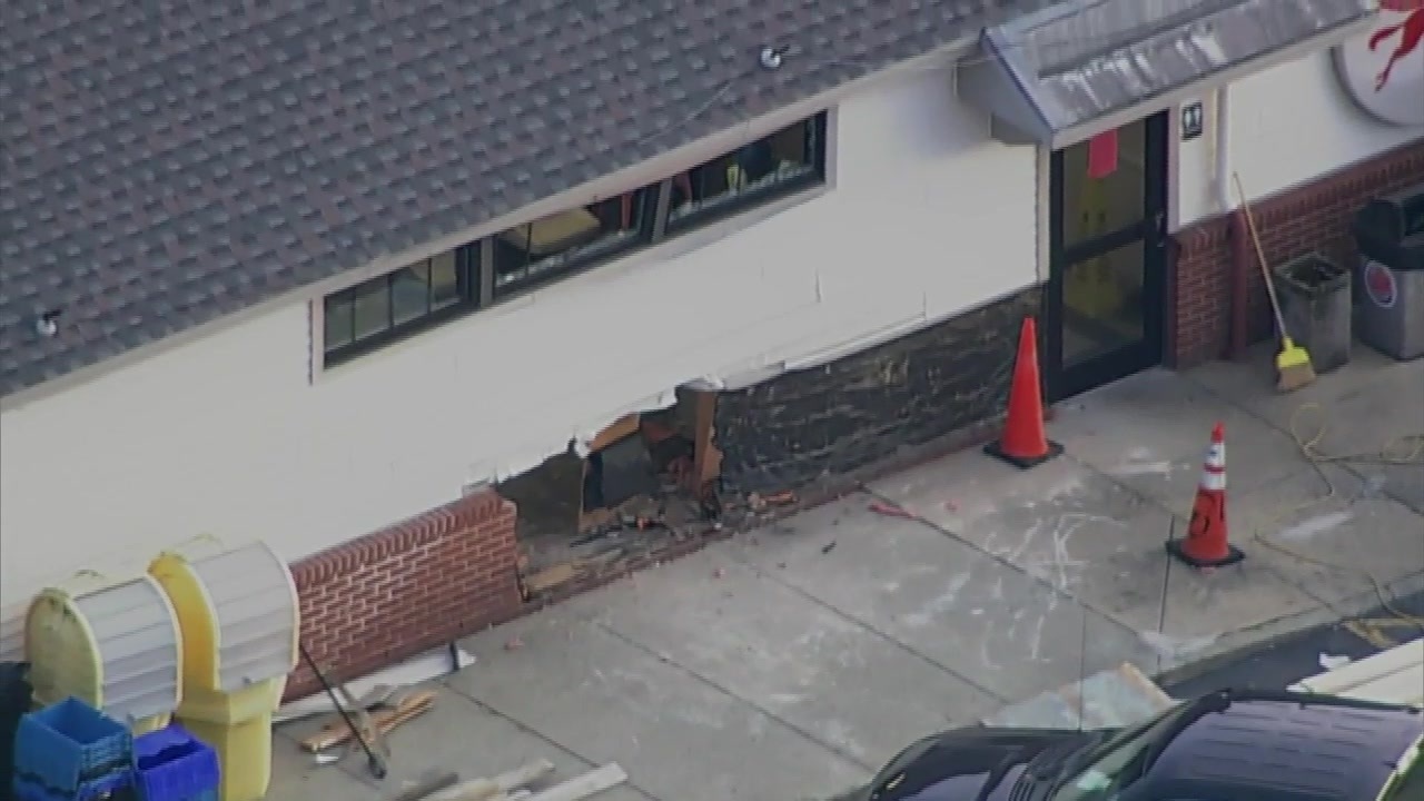 Investigation underway after woman crashes SUV into building in ... Investigation underway after woman crashes SUV into building in ...