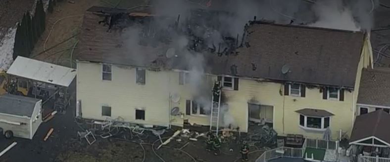 Firefighter hospitalized after falling through floor while battling ...