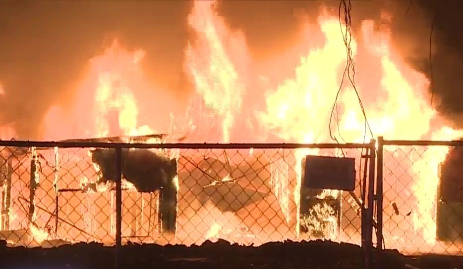 Investigation underway after flames tear through Everett warehouse ...