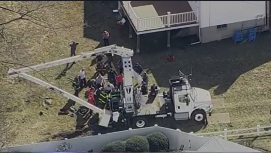 Rescue crews free man trapped under bucket truck near Braintree home ...