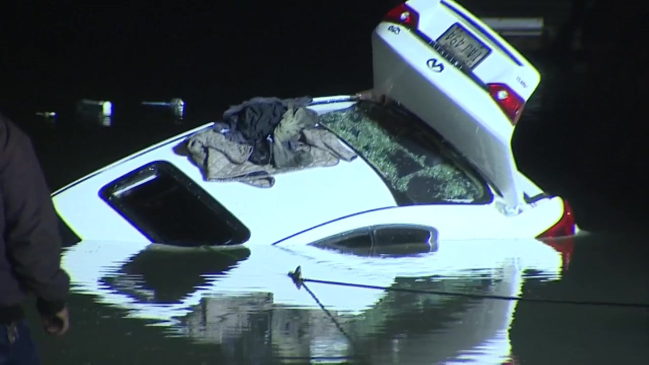 Police officers rescue man after car plunges into water on Cape Cod ...