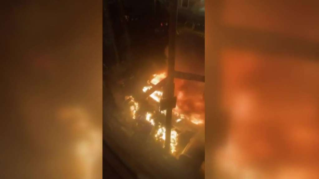 WATCH: Flaming trash cans used to set two vehicles on fire in South ...