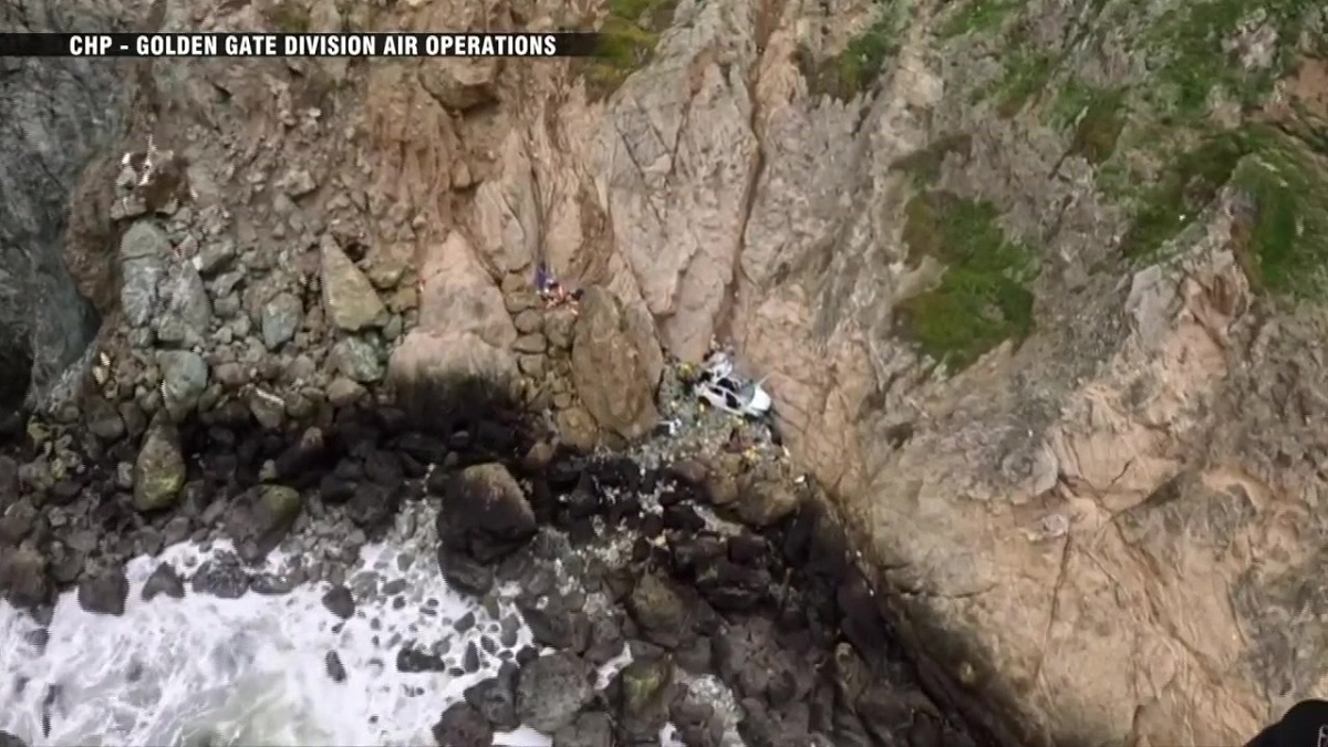 Tesla drives off cliff at Devil’s Slide, crews rescue 2 adults, 2 kids ...