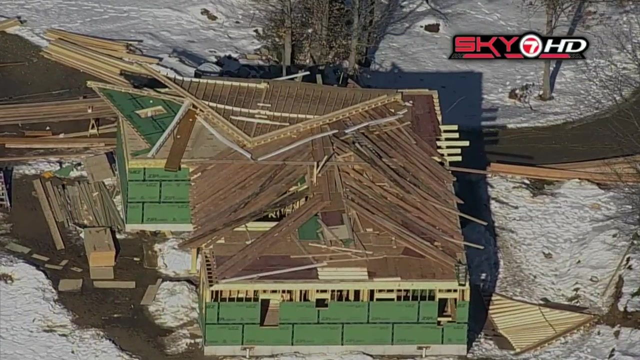 Two people taken to hospital after wind causes partial building ...