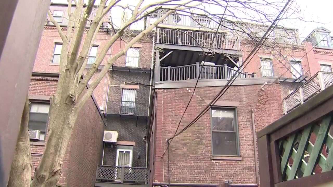 Woman taken to hospital after fall from third-floor balcony in Boston ...