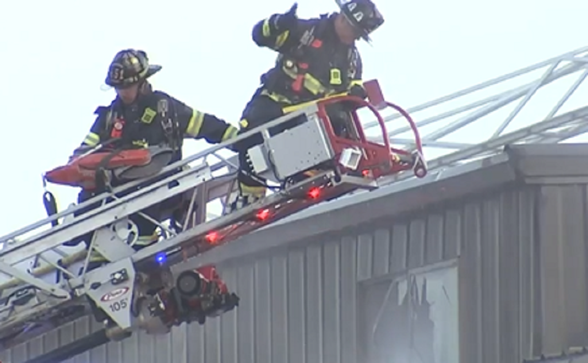Crews cut through steel walls to fight warehouse fire in Everett ...