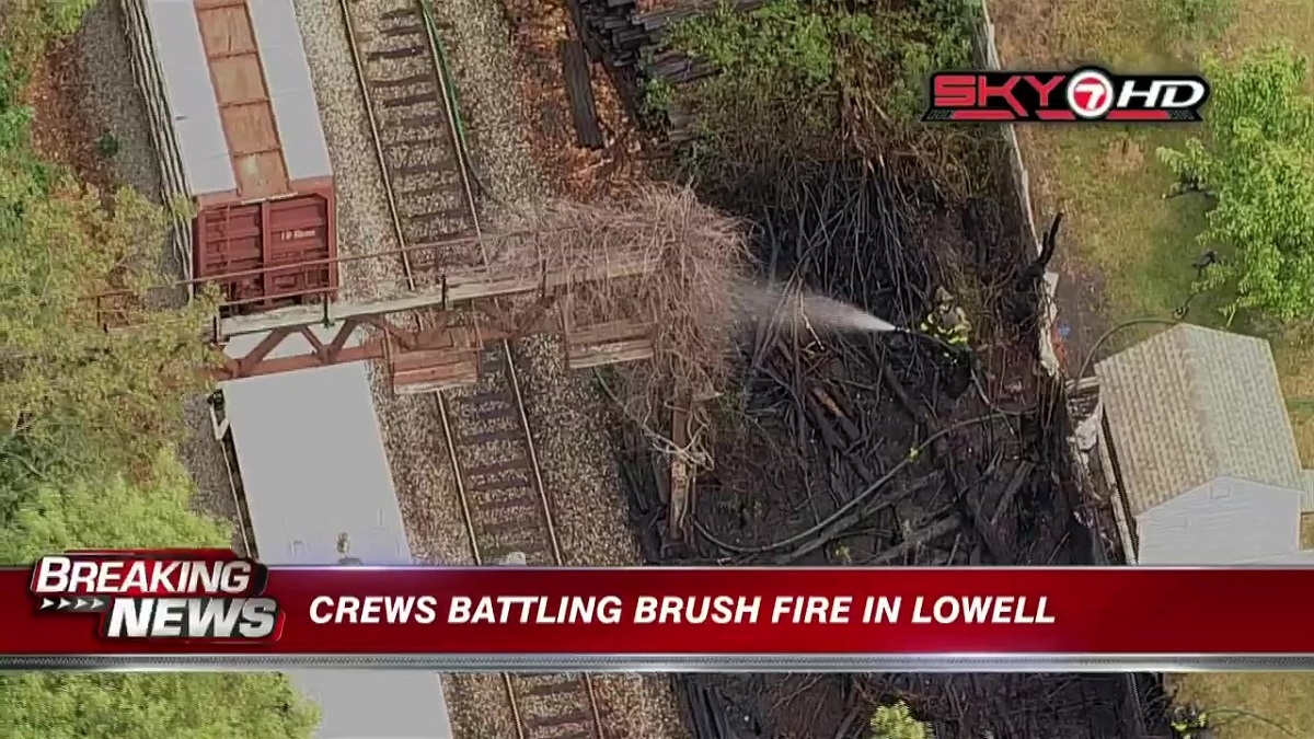 Crews battle brush fire near train tracks in Lowell - Boston News ...
