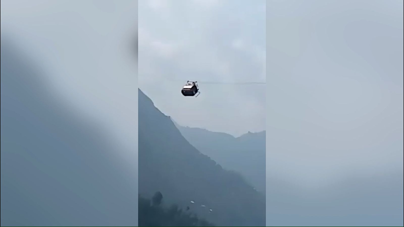 Rescuers save 8 people trapped in cable car dangling above canyon in ...