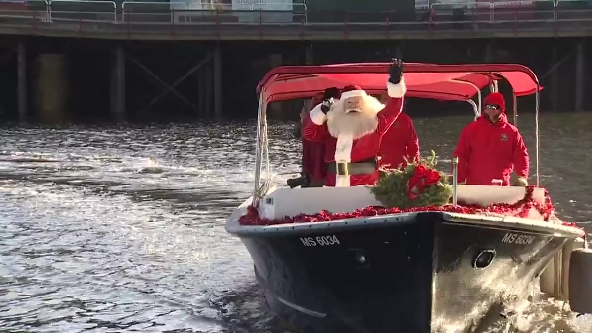 Santa trades sleigh for water taxi to hand out gifts in Seaport ...