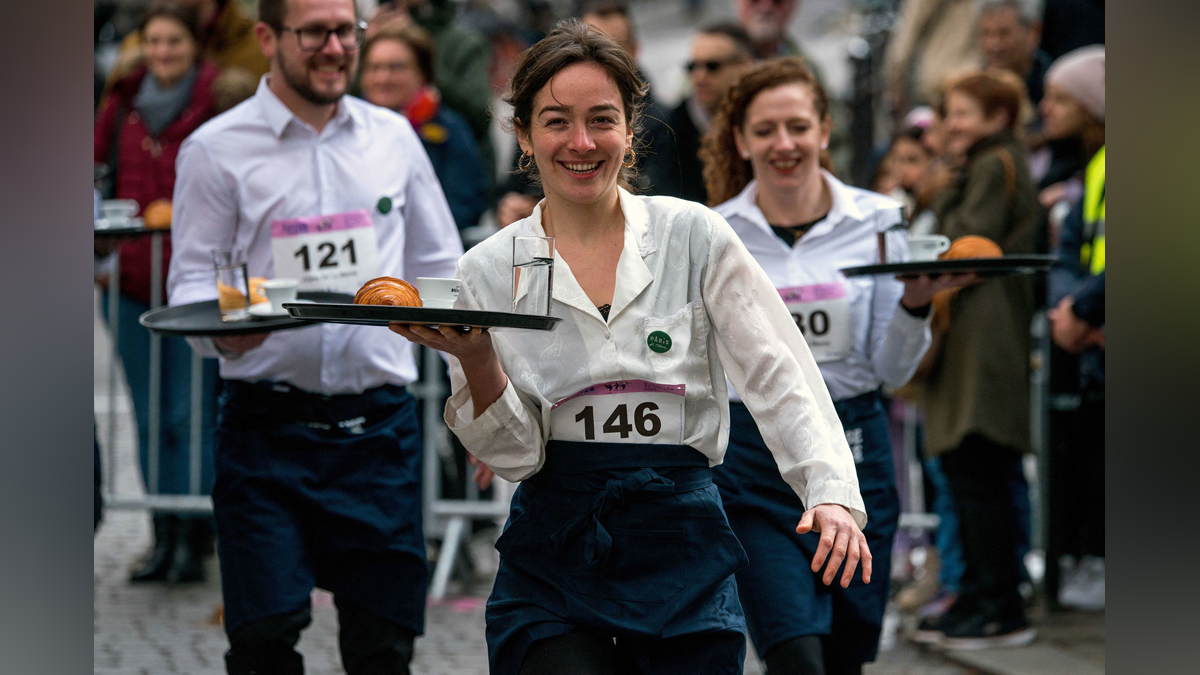 Paris waiters compete in race to get a coffee and croissant across the ...