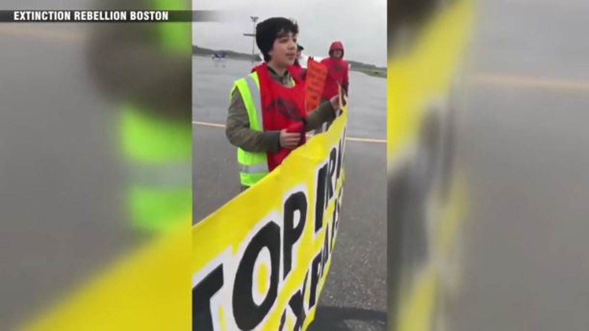 Climate activists arrested after protest on tarmac at Hanscom airfield ...