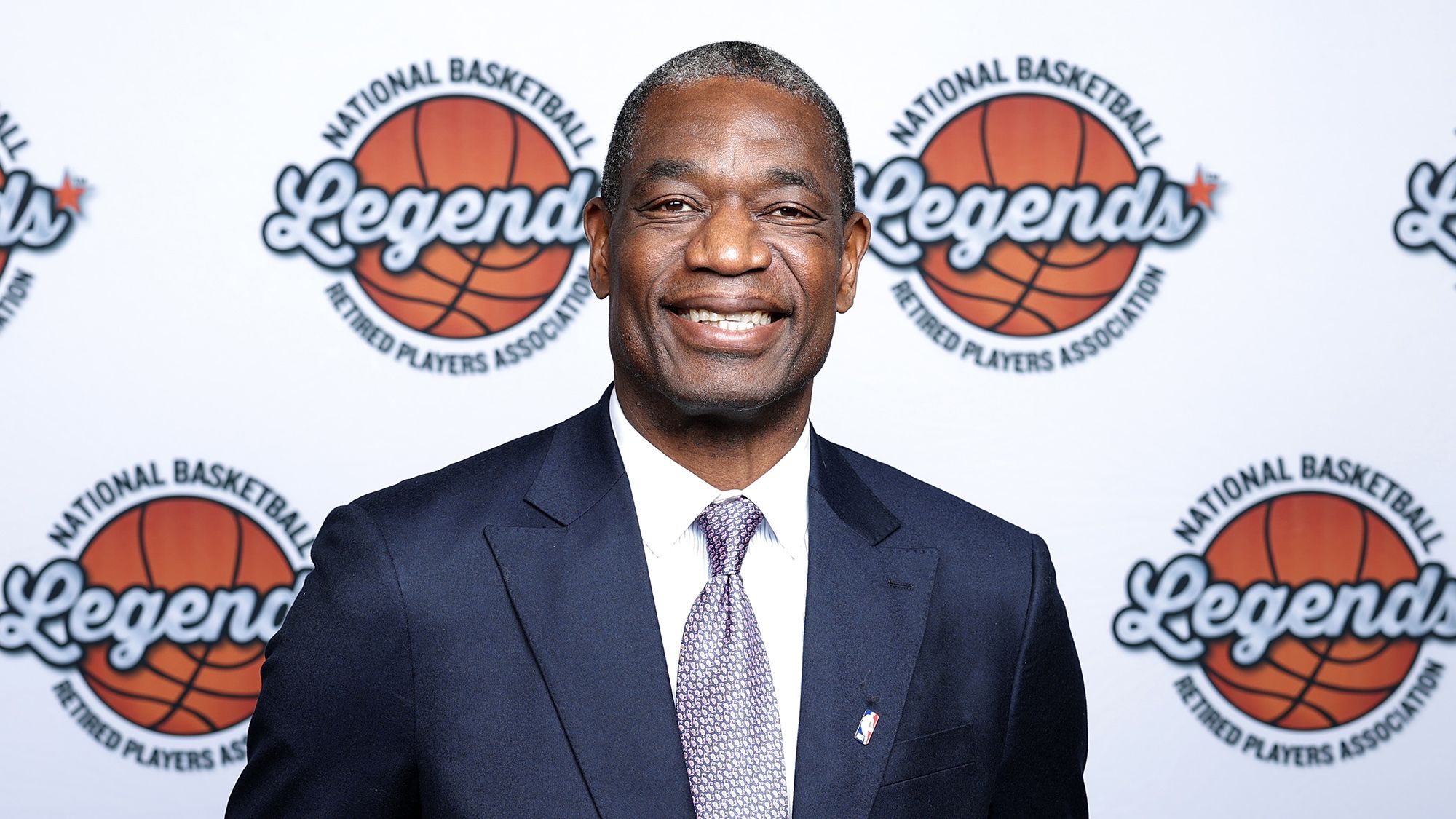 Basketball star Dikembe Mutombo, known for his shot-blocking skill and ...