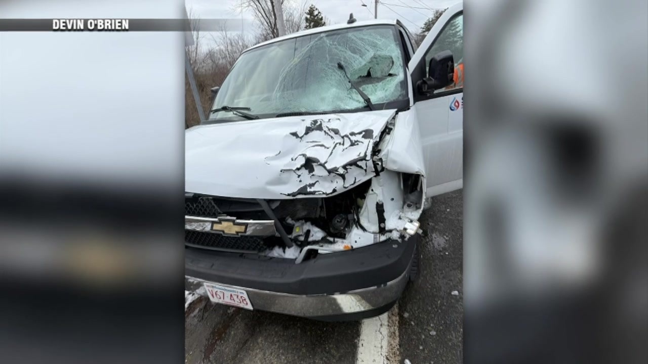 Driver reacting after being pulled from van hit by ice sheet in ...