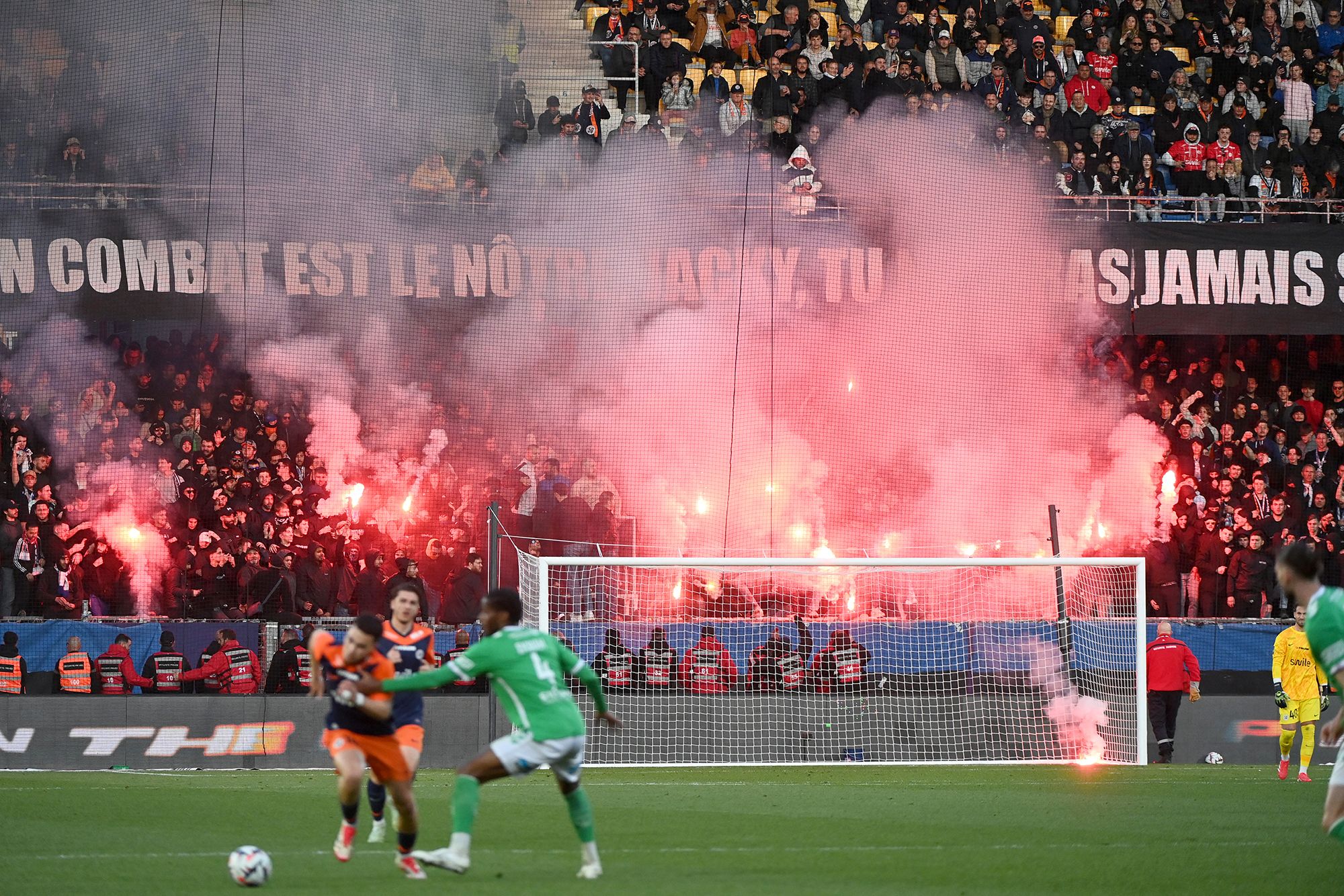 Soccer match in France postponed after fans throw flares and start fire ...