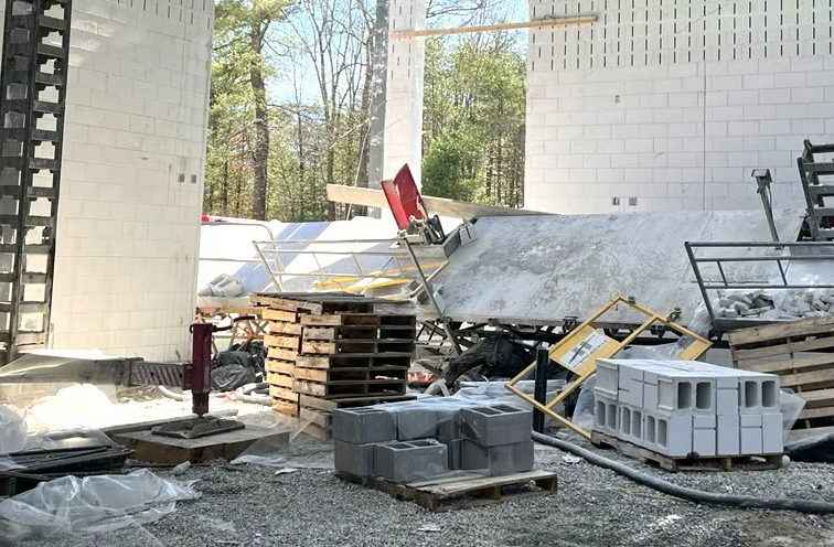 Scaffolding collapse causes part of wall to fall at school construction ...