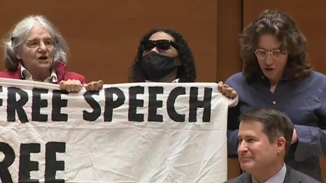 Protesters interrupt Rep. Moulton while speaking at Tufts, urging ...