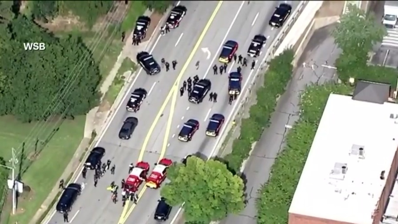 Suspected gunman and police officer dead in shooting near the CDC and ...