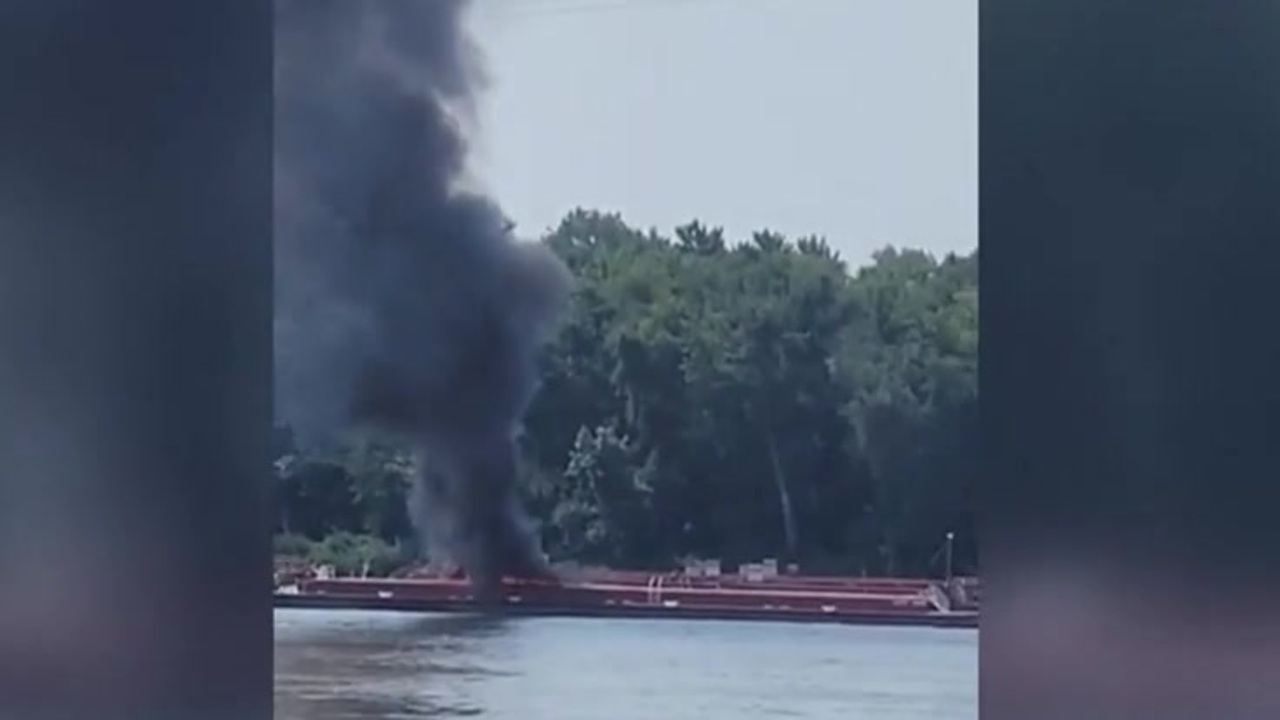 Two die when helicopter strikes powerlines and crashes into a barge on the Mississippi River ...