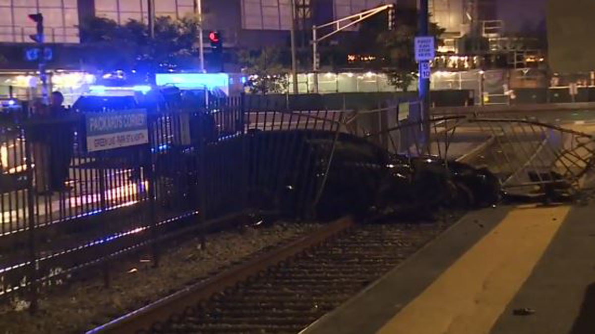 Driver crashes through fence, onto Green Line tracks near Packard’s ...
