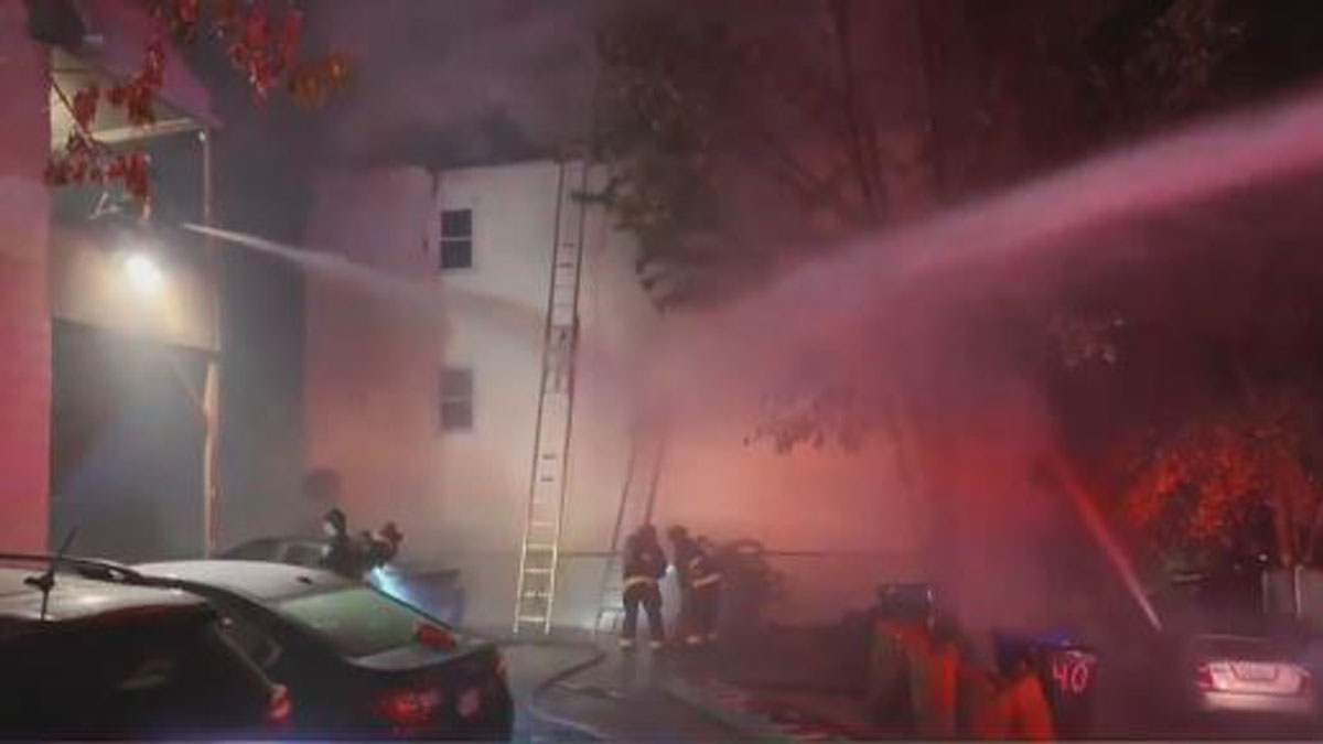 2 seriously injured after jumping from burning building in Manchester ...