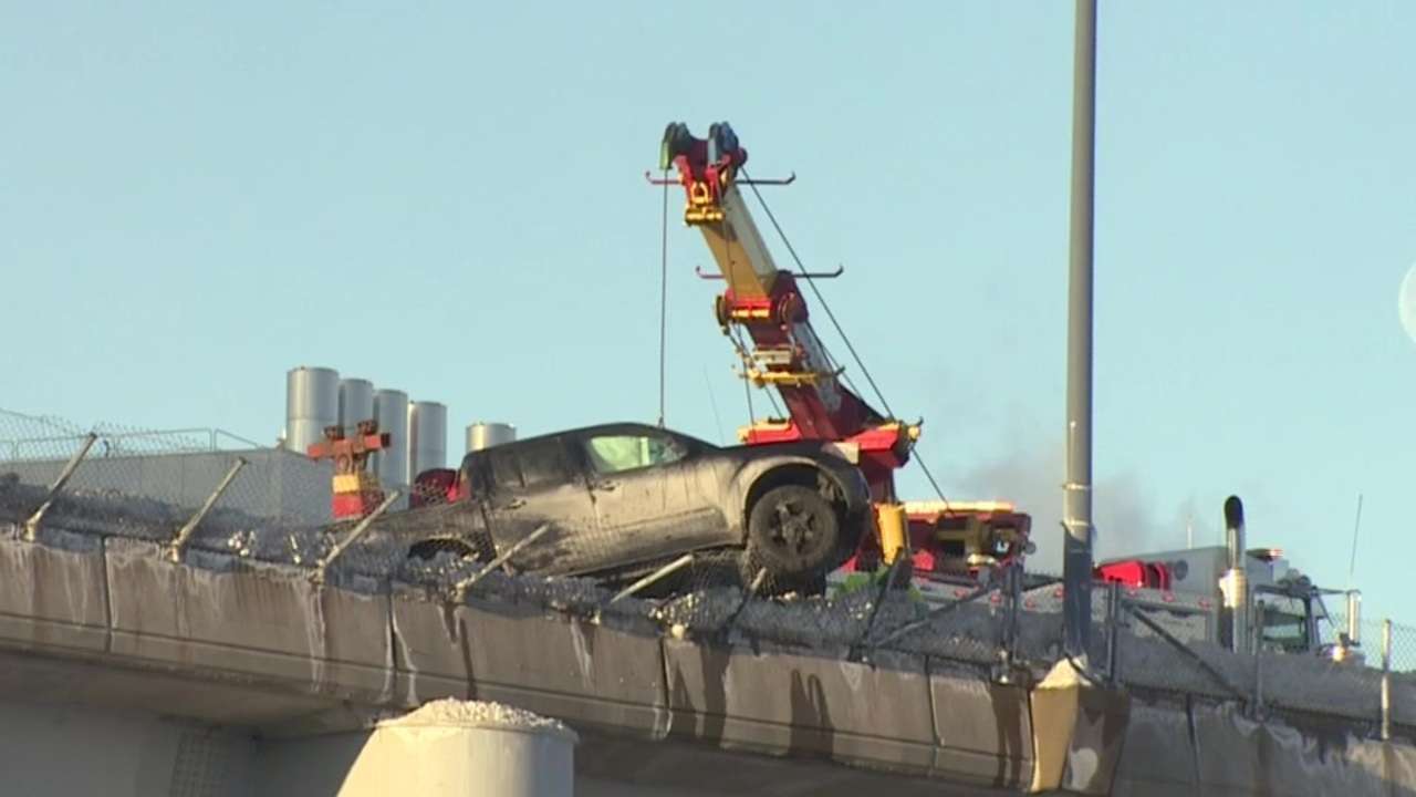 Pickup truck crashes into barrier, dangles over edge of Zakim Bridge ...