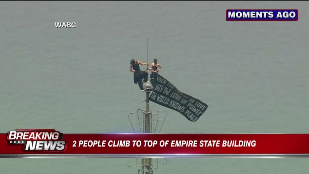 2 people hang banner about ‘the power of love’ on Empire State Building ...